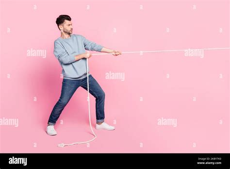 Profile Side Full Body Photo Of Guy Pulling String Have Victory