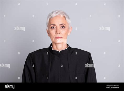 Photo Of Old Retired Woman In Black Robe Judge Look Isolated Grey Color