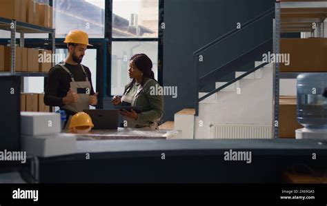 Dolly Out Shot Of Employees Doing Warehouse Inventory Analysis Keeping Quality Standards High