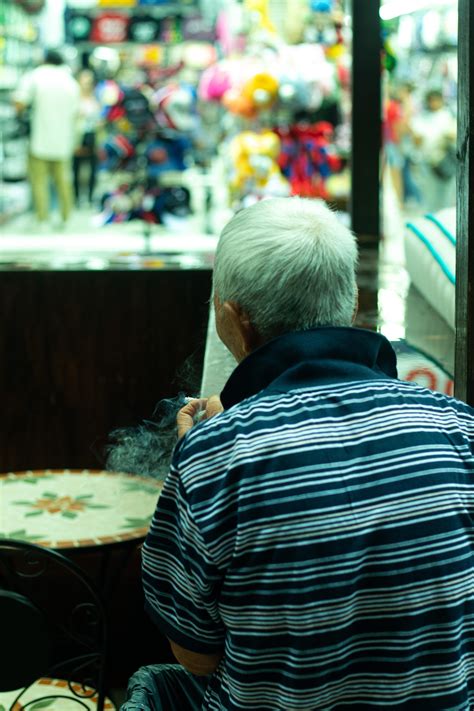 Photo Of A Man Enjoying A Cig In Chinatown Nyc Rpics