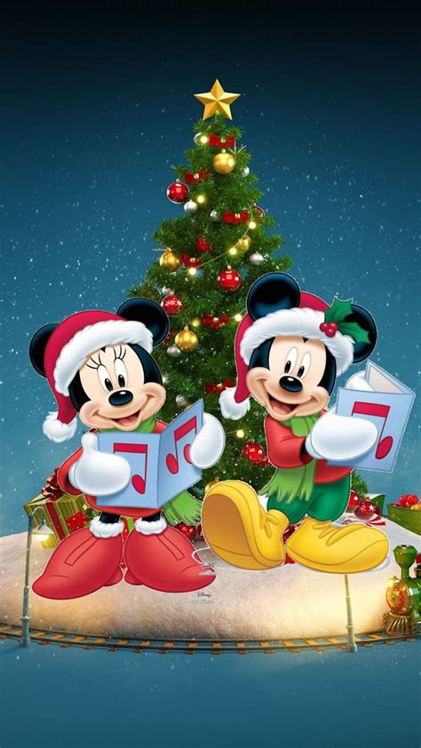 Two Mickey And Minnie Mouse Characters Sitting In Front Of A Christmas Tree
