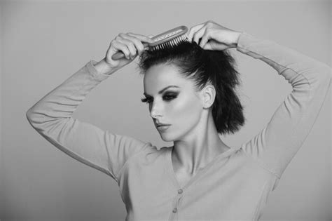 Premium Photo Woman Combing Hair Portrait Of Female Model With A Comb
