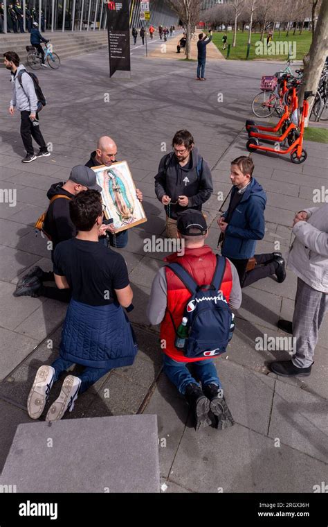 A Group Of Christian Protesters Kneel And Pray Outside The Building During Demonstrations About