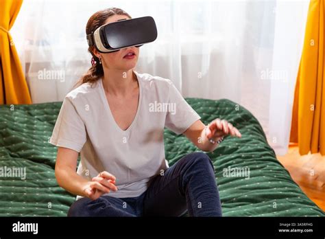 Portrait Of Woman Enjoying An Immersive Virtual Reality Adventure While