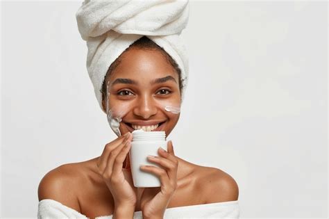 Premium Photo Skincare Cheerful Young Woman Smiling Applying