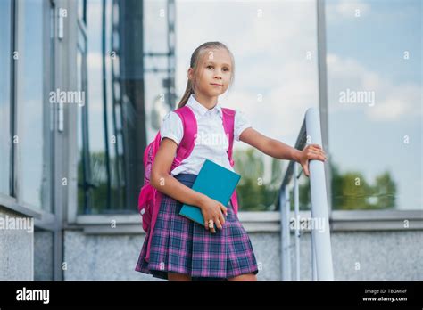 Back To School Portrait Of Beautiful Young Schoolgirl With Book And Backpack Education Concept