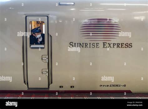 Train Conductor Performing Checks During The Departure Of The Sunrise