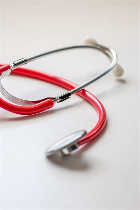 Red Stethoscope In Doctors Office For Professional Cardio Checkup And Healthy Heartbeat Pulse