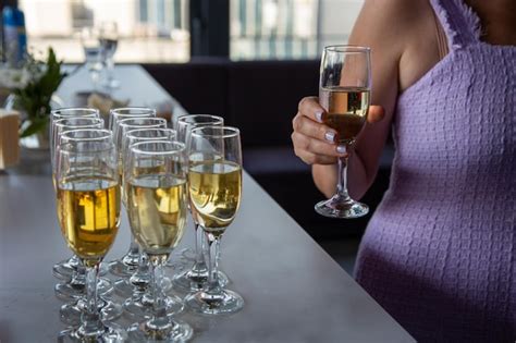 Premium Photo Woman Hand Holding Champagne Glass