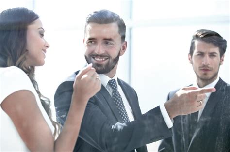 Premium Photo Manager Instructs Employees Standing In The Office