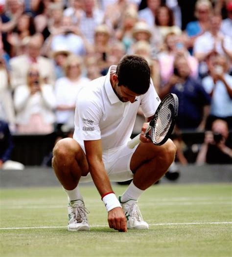 Novak Djokovic Eats The Wimbledon Grass After Winning The 2019