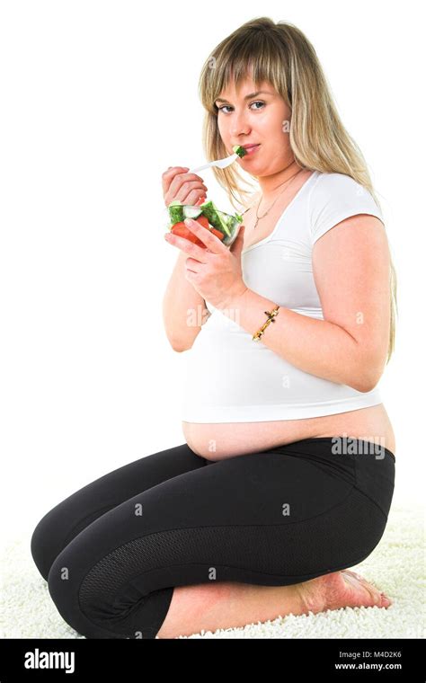 Pregnant Woman Eating Vegetables Stock Photo Alamy