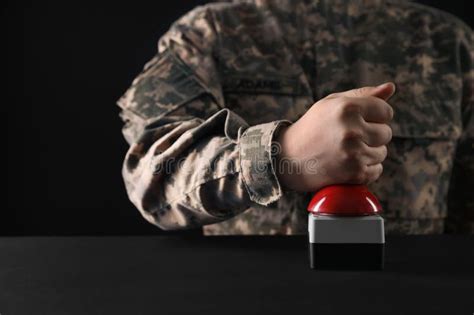 Red Button Of Nuclear Weapon On Black Background Top View With Space