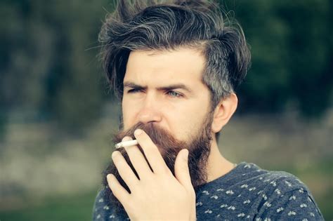 Premium Photo Bearded Man Smoking Cigarette Outdoor