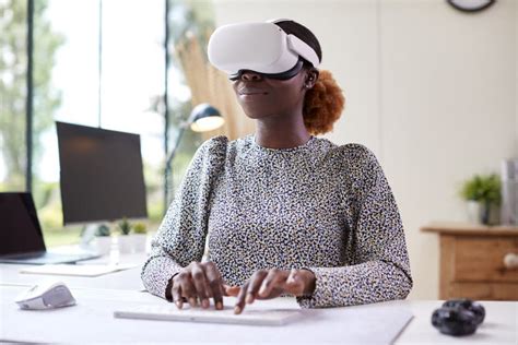 Woman Working From Home Office Sitting At Desk Wearing Vr Headset Using