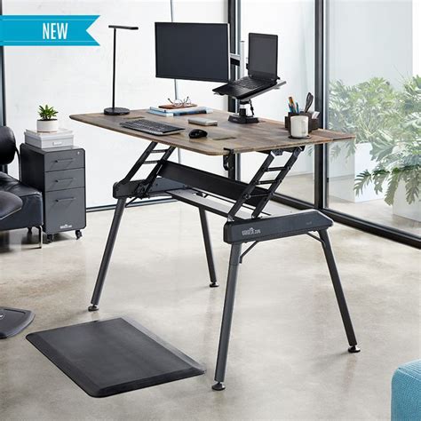 A Desk With A Computer On Top Of It