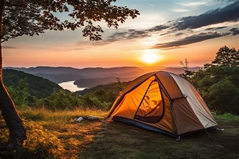 Premium Photo Camping And Tent In Nature Park With Sunrise Behind The