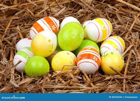 Colorful Painted Easter Eggs Hidden In A Nest Of Straw Stock Photo