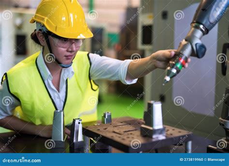 Waist Up Female Inspector Check Automatic Robot Arm In Factory Stock