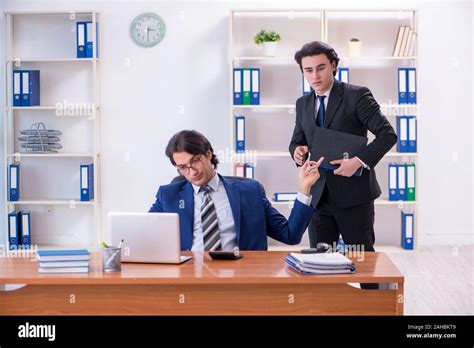 The Boss And His Male Assistant Working In The Office Stock Photo Alamy