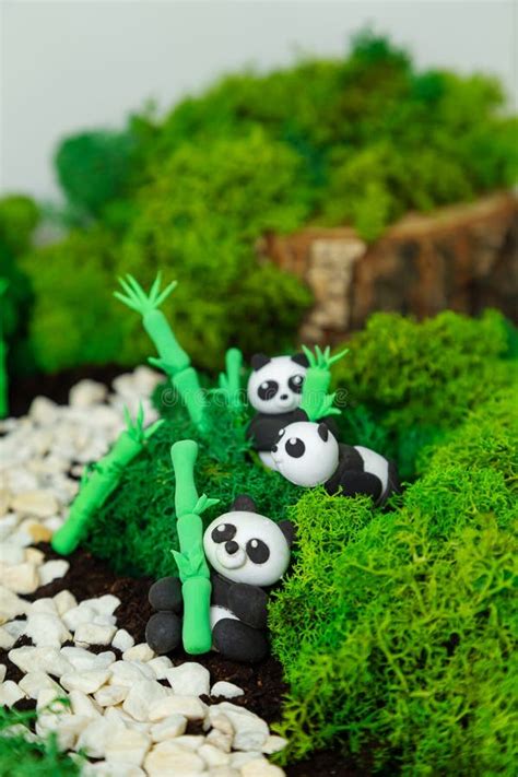 Funny Homemade Plasticine Pandas In A Stylized Jungle Stock Image