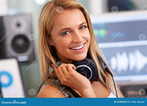 Ready To Produce A Hit A Beautiful Young Audio Engineer Sitting In Front Of Her Mixing Console