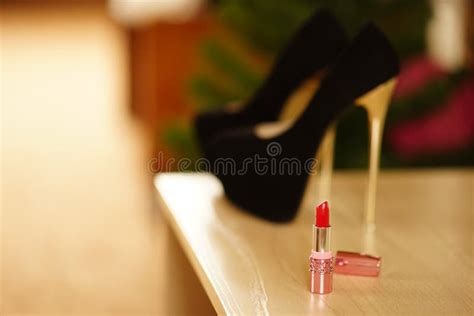 Red Lipstick And High Heel Women Shoes On The Table Stock Image Image