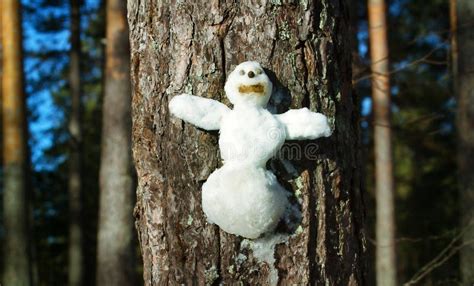 Snowman Figurine On A Tree Trunk Stock Image Image Of Girls