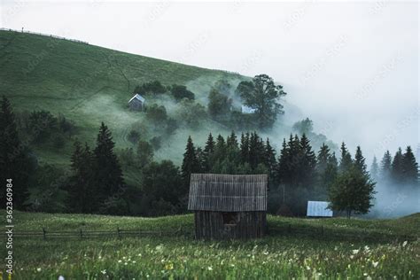 Beautiful View Of Small Cabin Surrounded By Inversion Fog In The