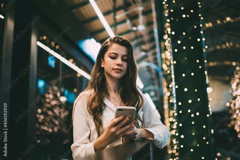 Attractive Woman Using G Wireless Connection On Modern Cellular Technology Browsing Web Page In