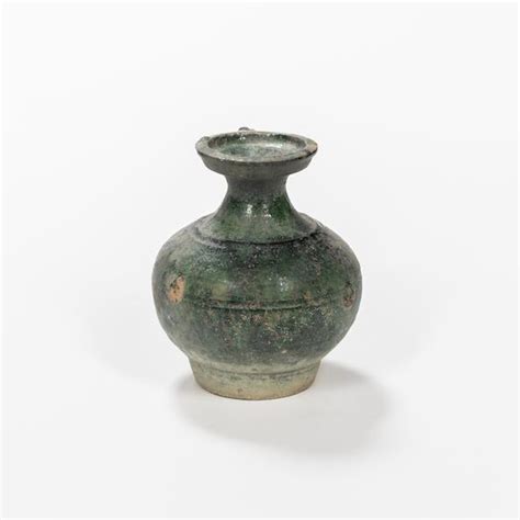 Bonhams Skinner Green Glazed Pottery Vase