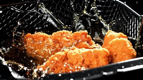 Chicken Nuggets Fall Into Hot Oil Filmed On A High Speed Camera At