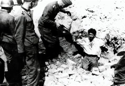 Waffen Ss Force A Jewish Man From His Bunker During The Warsaw Ghetto Uprising 9 May 1943 [1168