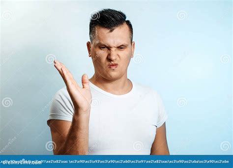 Close Up Portrait Of A Man Closes His Nose With His Hands On A Light