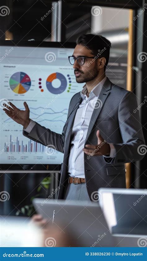 Professional Speaker Giving A Business Presentation With Graphs And