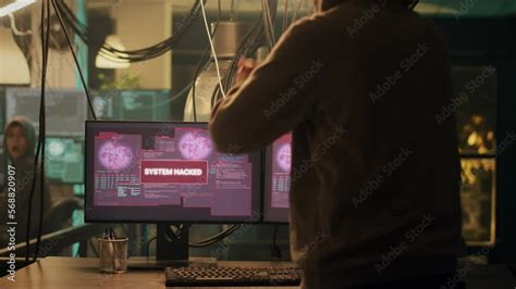 male thief enjoying cybercrime achievement at night breaking into