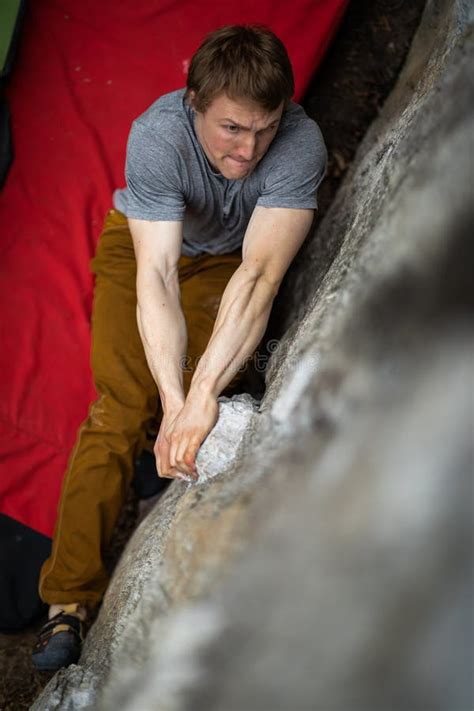 A Rock Climber Climbing On A Boulder Rock Outdoors Stock Image Image Of Beautiful Friends