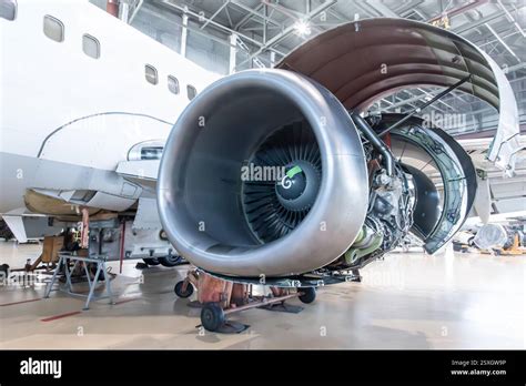 Close Up Of An Open High Bypass Turbofan Aircraft Engine Of A Passenger Airliner In Airplane