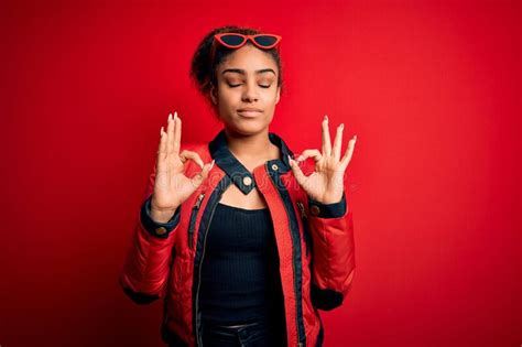 Beautiful African American Girl Wearing Red Jacket And Sunglasses Over