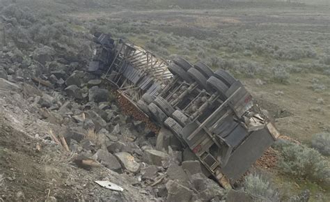 Potato Truck Rolls Down Embankment Catches Fire Injuring Driver