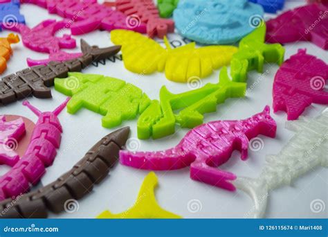 Many Bright Multi Colored Objects Printed On 3d Printer Lie On Flat