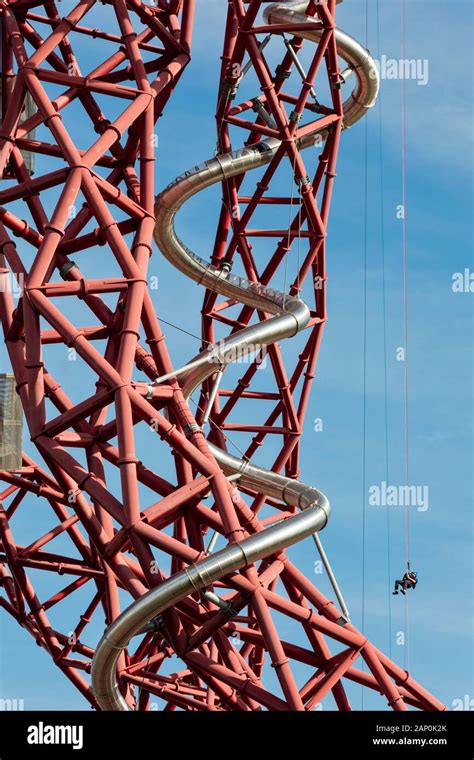 An Abseiler Descends To The Bottom Of The Arcelormittal Orbit Sculpture