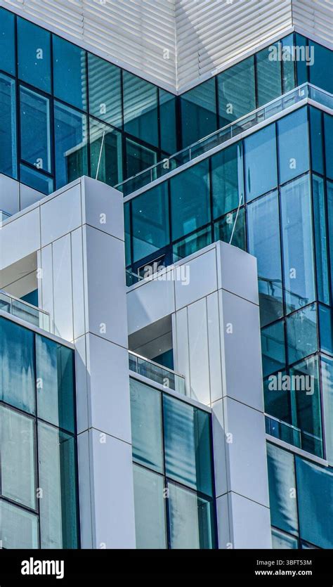 Abstract Modern Building Facade Made Of Glass And Metal With Strong