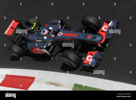 British Formula One Driver Jenson Button Of Mclaren Mercedes Steers His