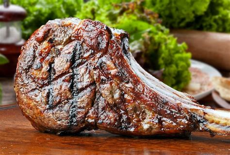 Premium Photo Freshly Grilled Tomahawk Steaks
