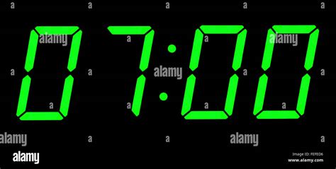 Digital Clock Shows At Seven O Clock In The Morning Isolated On A