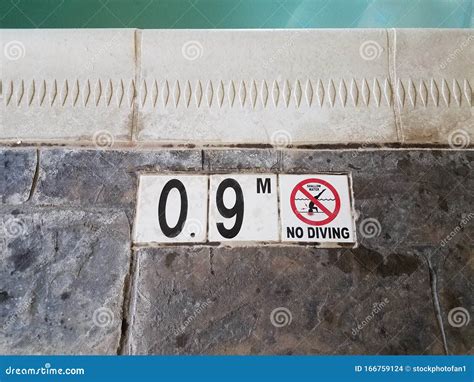 No Diving Sign Or Symbol At Edge Of Swimming Pool Stock Photo Image