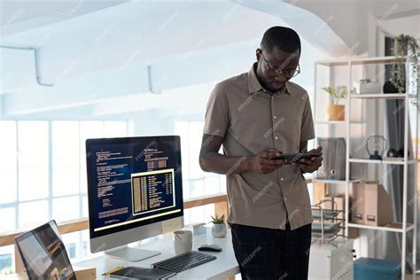 Premium Photo Serious Software Developer Testing New Application On
