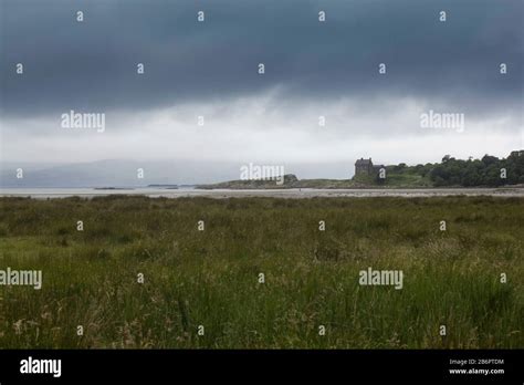 A Castle On The Scottish Coast Of Argyle On A Cloudy Summers Day Stock