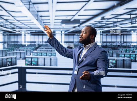 engineer in data center implementing backup solutions to protect